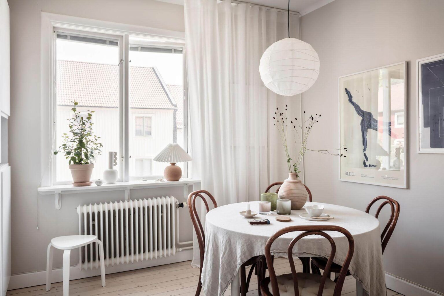 A Living Room with Pink Accents in a Light Attic Apartment - The Nordroom