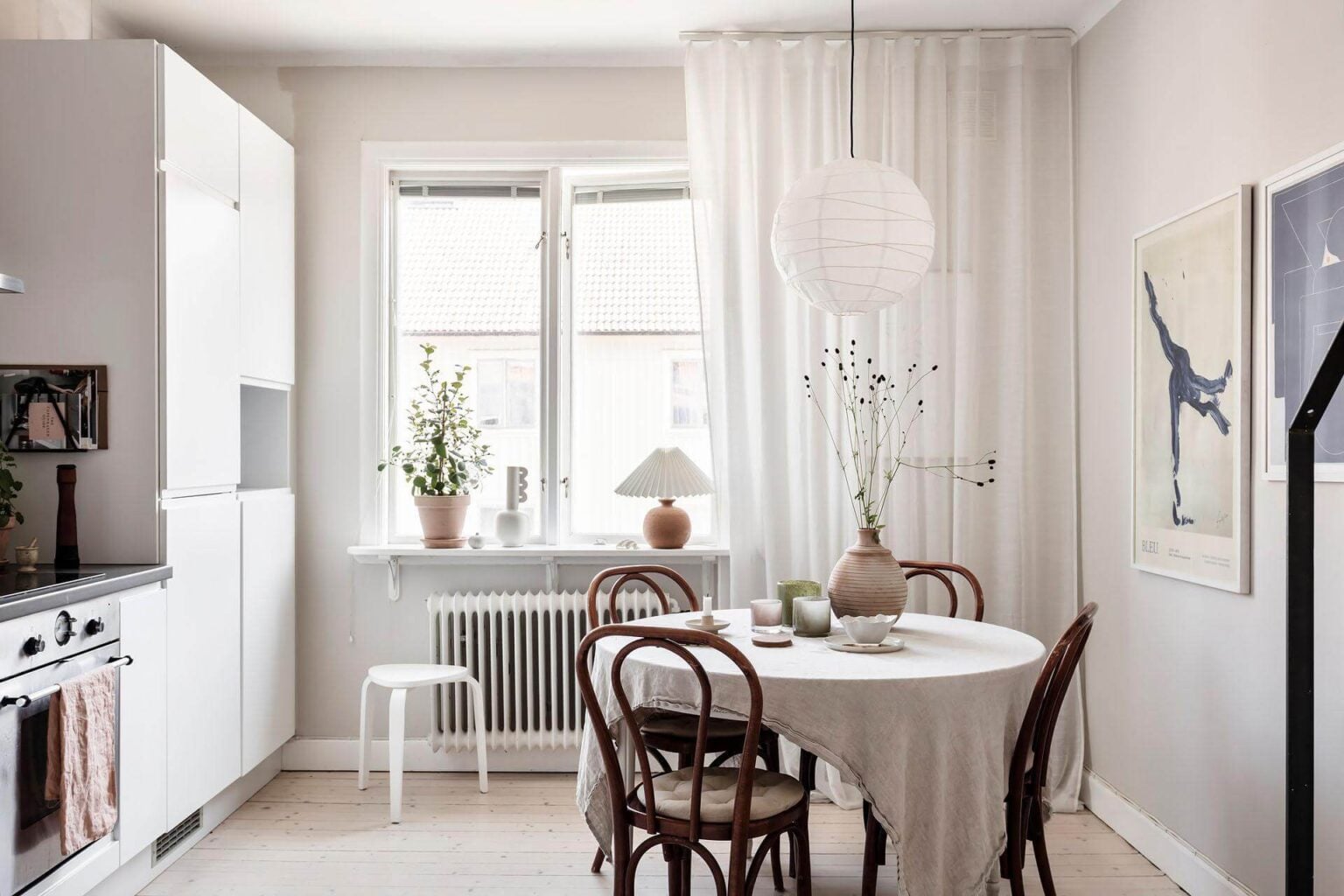 A Living Room with Pink Accents in a Light Attic Apartment - The Nordroom