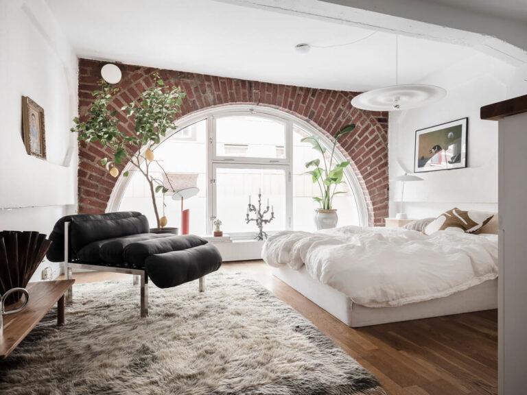 A Scandinavian Loft with Brick Wall and Arched Window - The Nordroom