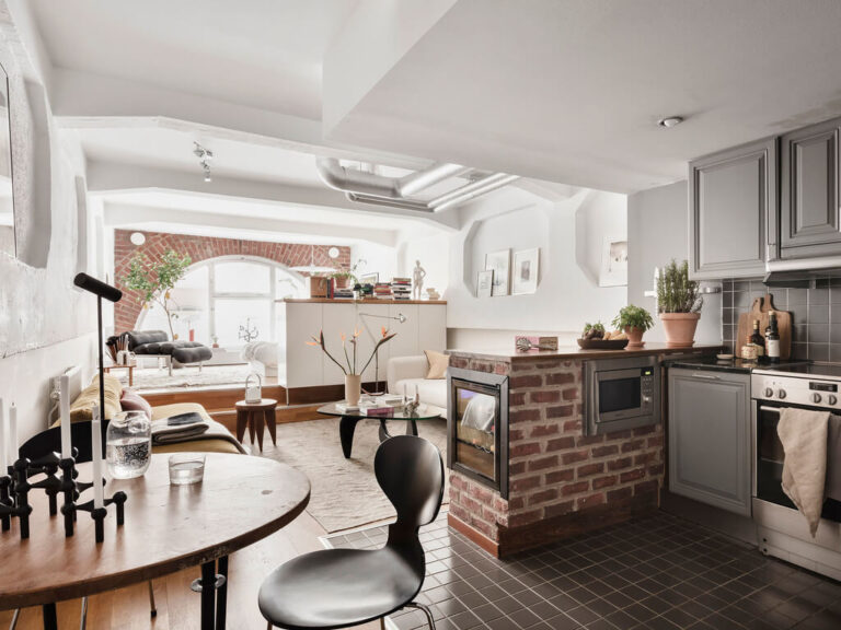 A Scandinavian Loft with Brick Wall and Arched Window - The Nordroom