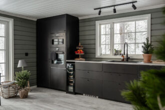 A Gray Swedish Log House Decorated for Christmas - The Nordroom