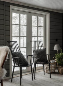 A Gray Swedish Log House Decorated for Christmas - The Nordroom