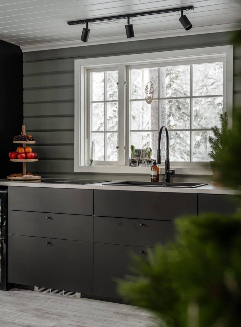 A Gray Swedish Log House Decorated for Christmas - The Nordroom
