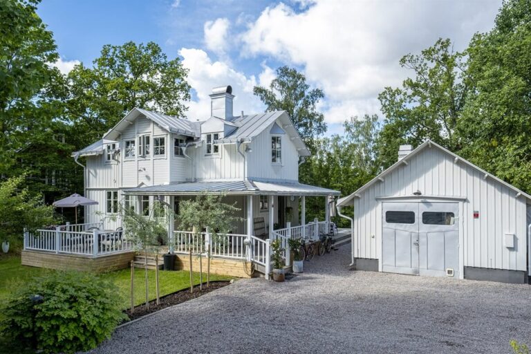 A White Swedish Villa with a Veranda and a Swimming Pool - The Nordroom