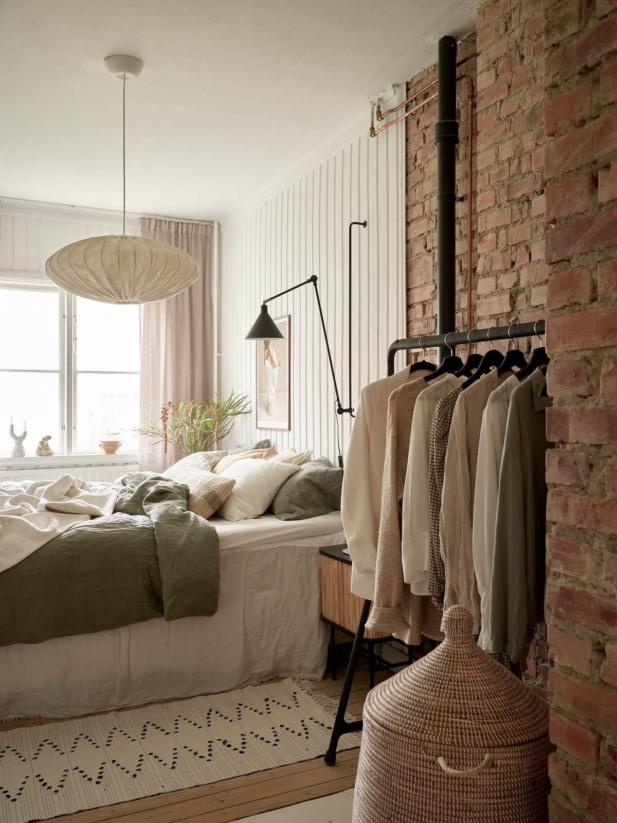 A Swedish Apartment with a Dark Blue Living Room and Exposed Brick ...