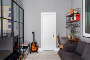 A Gray Studio Apartment with an Industrial Room Divider - The Nordroom