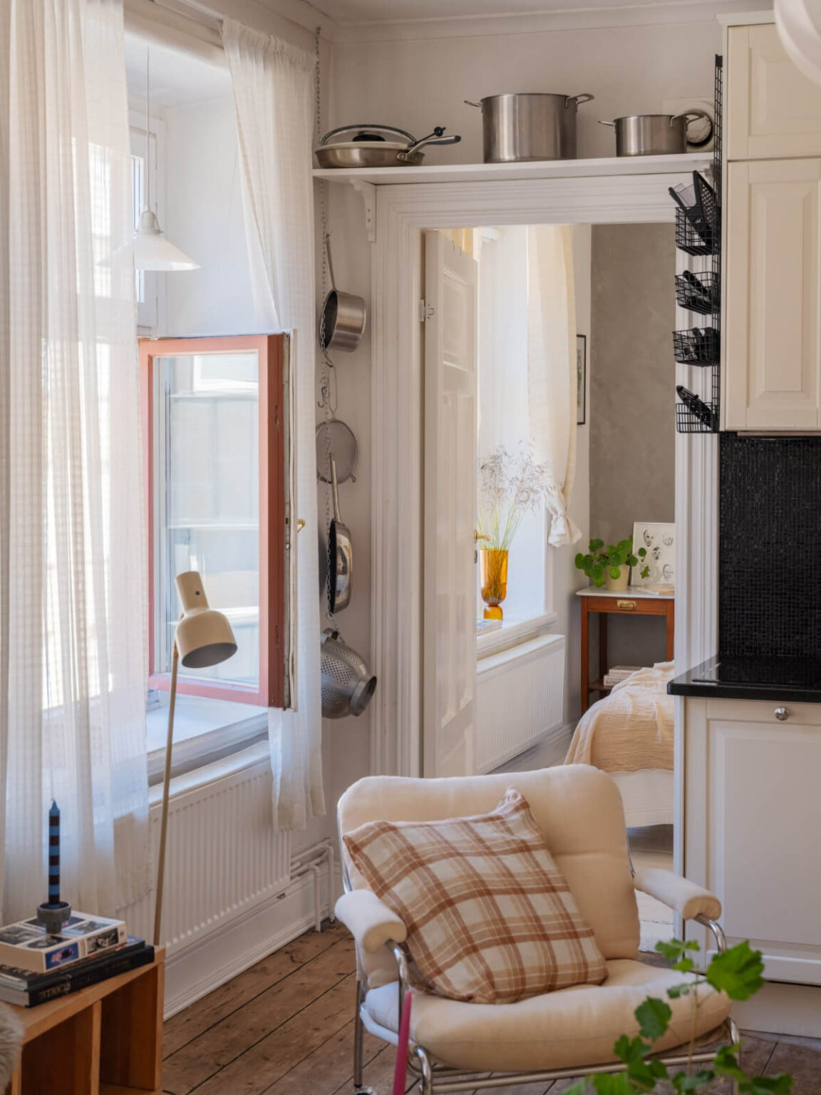 A Small Apartment with Rustic Floorboards and Beige Walls - The Nordroom