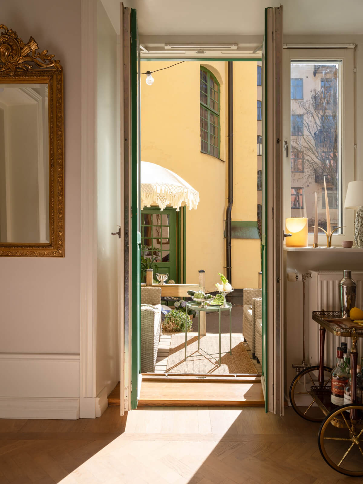 A Small Apartment with Green Color Accents and a Cozy Patio Terrace ...